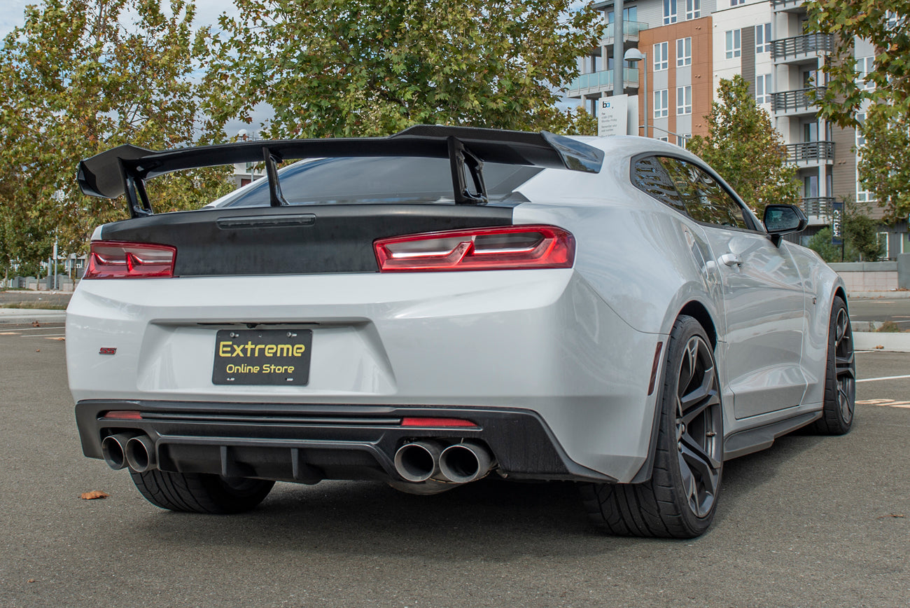 What is the use of wings in racing cars?